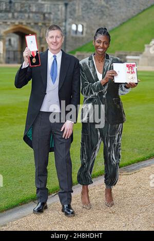 Dame Sharon White and her husband Sir Robert Chote with the awards they ...
