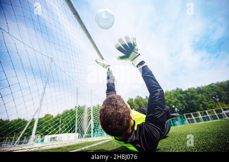 Goalkeeper soccer man didnt catch ball after penalty Stock Photo - Alamy