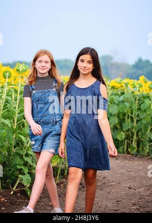 Teen best friends girls happy together kissing hug Stock Photo - Alamy