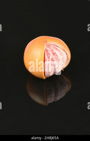 Grapefruit isolated on acrylic black background. High resolution photo ...