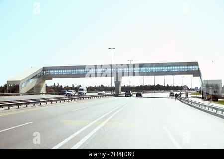 overground pedestrian crossing . Pedestrian bridge across the highway ...
