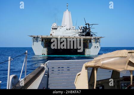 Utility landing craft LCU-1665 is tied to a pier. Base: Naval Station ...