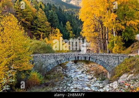 The old stone arched Katouna bridge in Krania village, Aspropotamos ...
