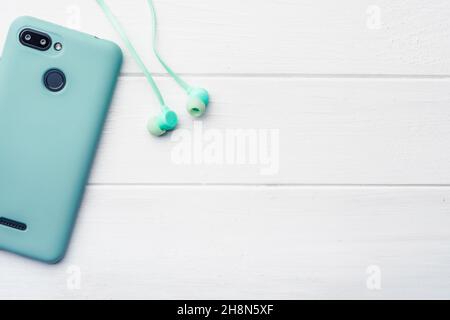 Digital telephone with protection and headphones at the table, close-up ...
