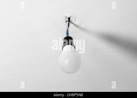 Temporary lighting electric wire on construction site Stock Photo - Alamy