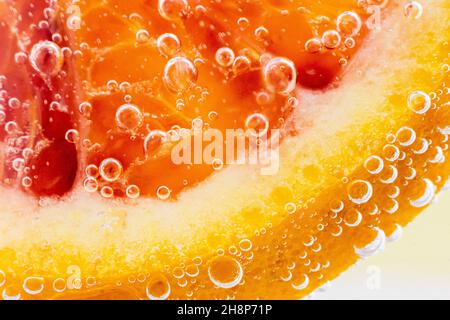 Grapefruit juice and ripe grapefruits set, on blue textured summer ...