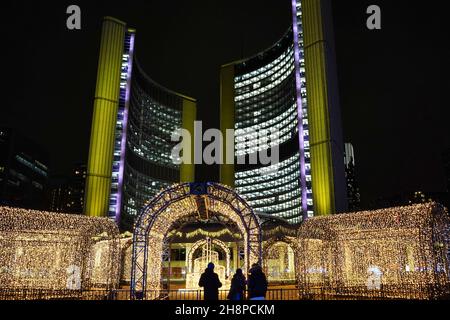 Toronto, Canada - November 30, 2021: Toronto City Hall square is lit up ...