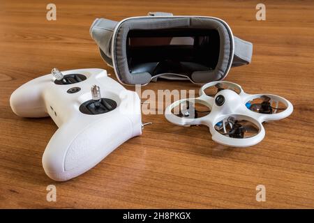 small white indoor home brushless fpv quadcopter Stock Photo - Alamy