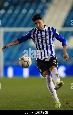 Theo Corbeanu #23 of Sheffield Wednesday runs forward with the ball ...