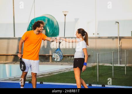 Friends playing padel Stock Photo - Alamy