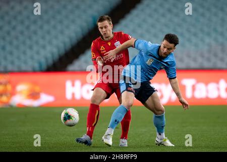 Sydney FC midfielder Alexander Baumjohann (5) and Adelaide United midfielder Riley McGree (8 ...