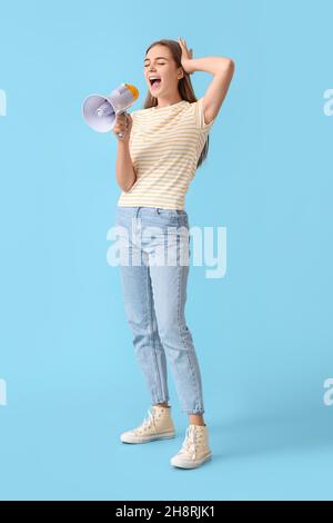 Young woman shouting in megaphone, technology announcement concept ...