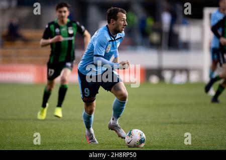 Sydney FC forward Adam Le Fondre (9) and Adelaide United player Ryan Strain (4) fight for the ...