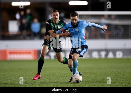 Western United defender Dylan Pierias (5) tries to get the ball past Sydney FC midfielder ...
