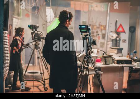 Behind the scene. Multiple camera setup. Cameraman shooting the film ...
