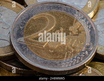 A high angle shot of different euro coins on a table Stock Photo - Alamy