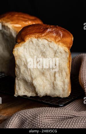 Delicious split halves of sandwich bread on grill tray placed on ...