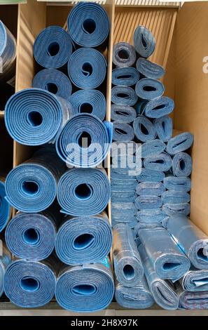 a roll of special insulation material is folded on a rack. High quality ...