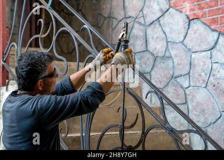 Man preparing welding machine for work Stock Photo - Alamy
