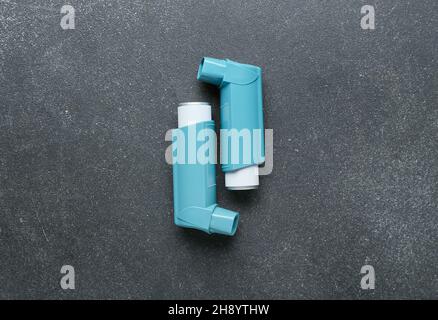 Modern inhalers on dark background Stock Photo - Alamy