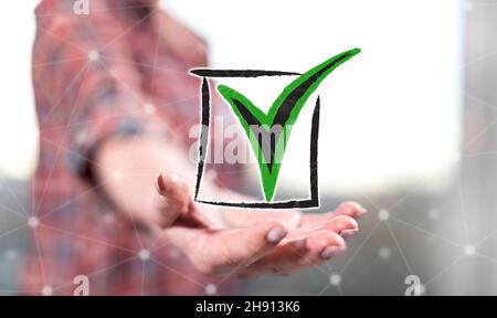 Validation concept above the hand of a woman in background Stock Photo ...