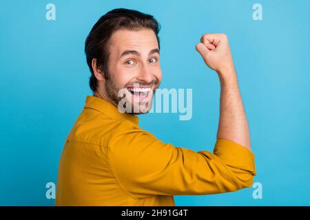 Photo of impressed millennial guy hand face look promo wear green shirt ...