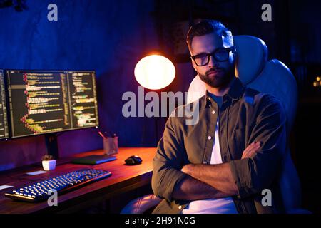 Photo of handsome geek nerd coder in spectacles green pullover writing ...