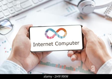 Logo of DFINITY Foundation Internet Computer in tablet. Cryptocurrency ...