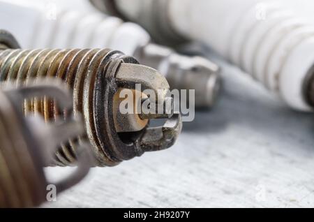 Closeup photo of old used spark plug for internal combustion engine ...