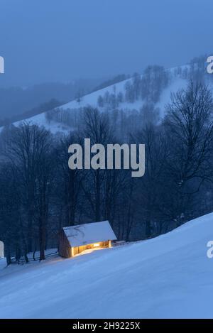 Night winter landscape with wooden house Stock Photo - Alamy