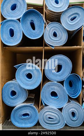 a roll of special insulation material is folded on a rack. High quality ...