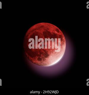 A glowing blood moon during a partial lunar eclipse at night Stock ...