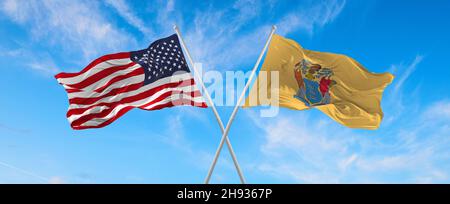 New Jersey state flags waving with the american flag on a clear day. US ...