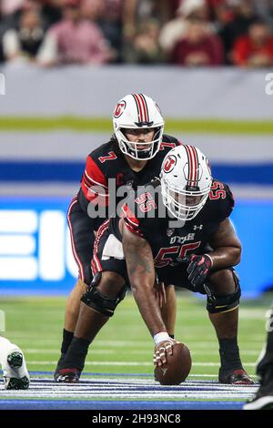 Utah quarterback Cameron Rising, center, warms up before the Pac-12 ...