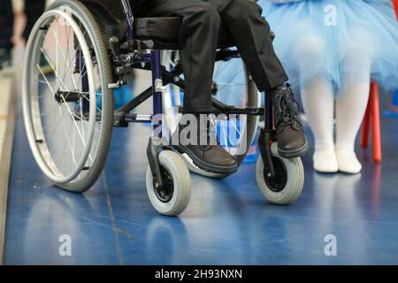 Young disabled boy with cerebral palsy lying on floor mat at home ...