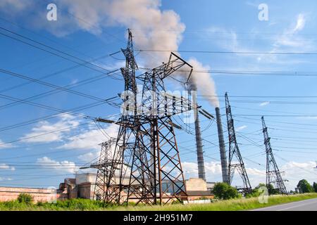 electric pylon and pipes of coal burning power station Stock Photo - Alamy