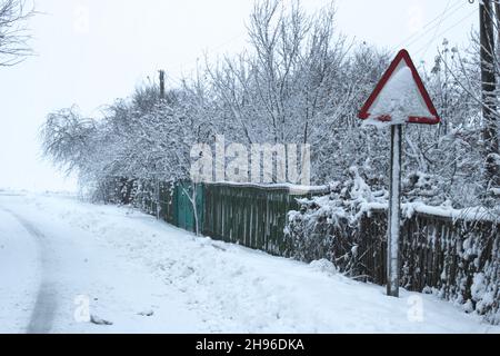 Snow covered traffic light and trees near town of Banff, Canadian ...