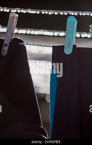 Items of laundry pegged to a wet washing line shot close up Stock Photo ...