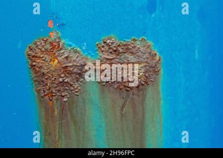 Painted iron surface with deteriorating surface showing rust coming ...