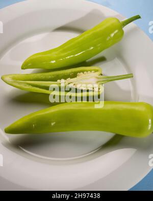 Close up of frsh green chilli peppers on tabel Stock Photo - Alamy