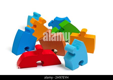 Colorful wooden puzzle pieces against white background Stock Photo - Alamy