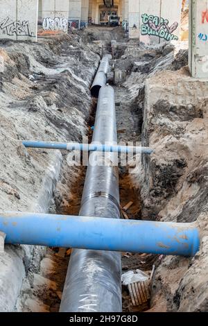 Reconstruction site of district heating system pipeline and replacement of old pipes with new ...