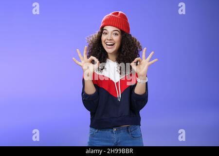 Got under control. Portrait of happy charming smiling curly-haired ...