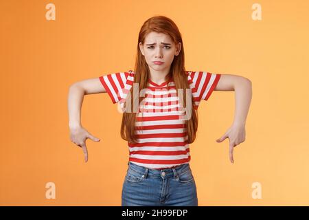 Cute timid hesitant ginger female taking tough decision feel pressured ...