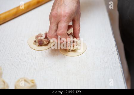 Cooking process. Manti is a very popular recipe in most cuisines ...