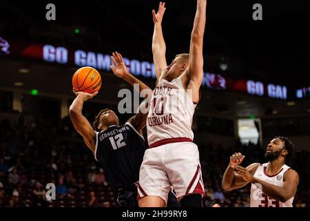 East Carolina guard Jordan Riley (12) has his shot defended by ...