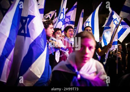 Lod, Israel. 05th Dec, 2021. Right-wing protesters hold Israeli flags ...