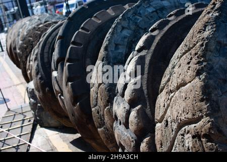 Various sized, colored and shaped tyre wheels in the view Stock Photo ...