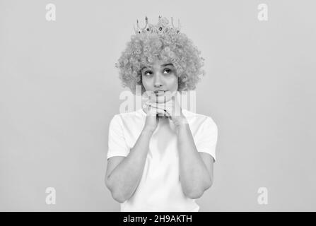 egoistic funny girl with fancy look wearing orange hair wig and ...