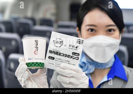 An ANA flight attendant introduces children's menko of "Demon Slayer ...